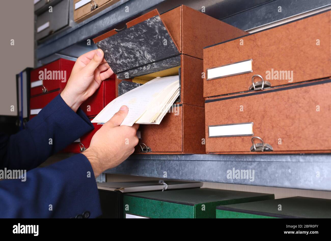 Many documents in hands hi-res stock photography and images - Alamy
