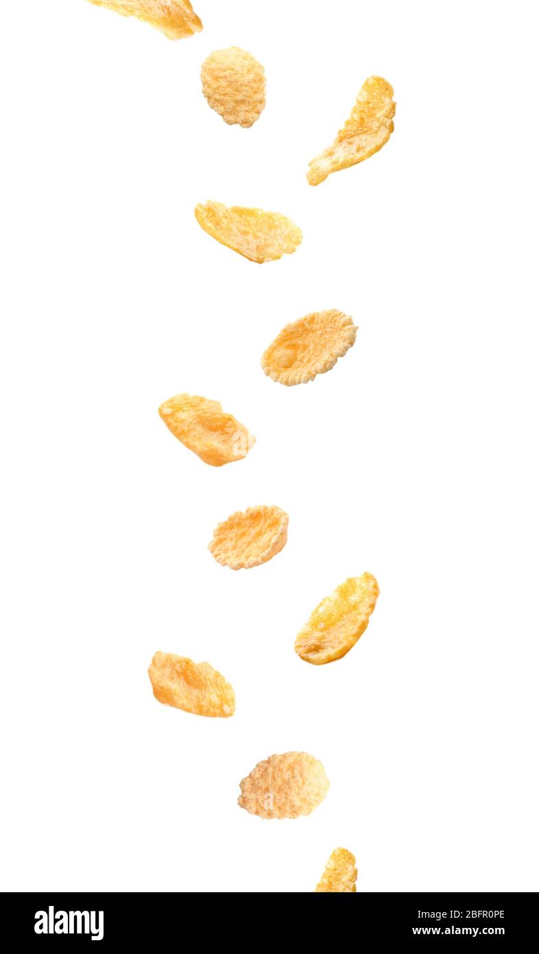 Falling corn flakes on white background Stock Photo - Alamy