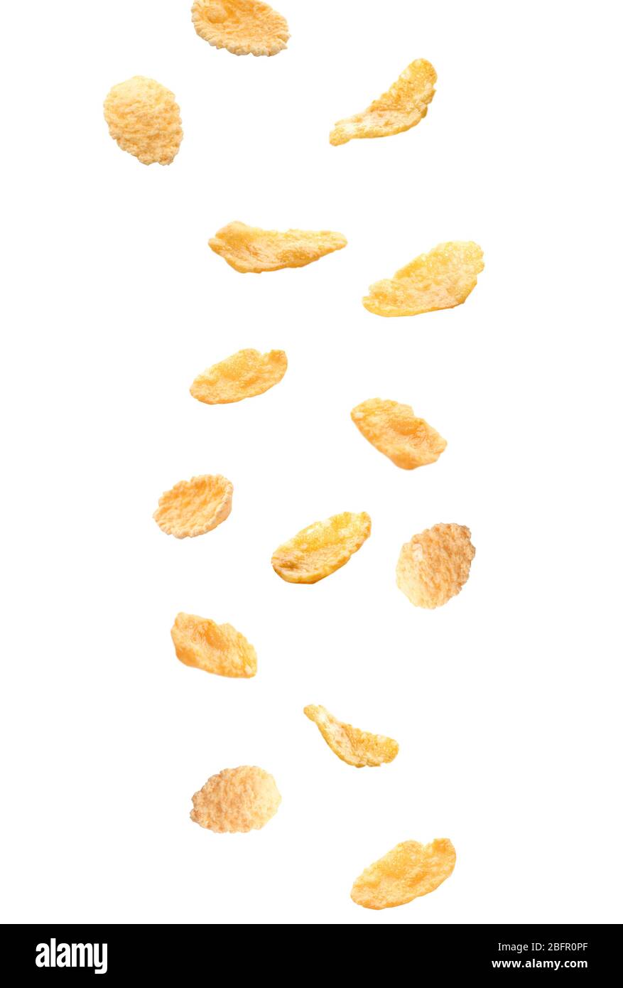 Falling corn flakes on white background Stock Photo - Alamy