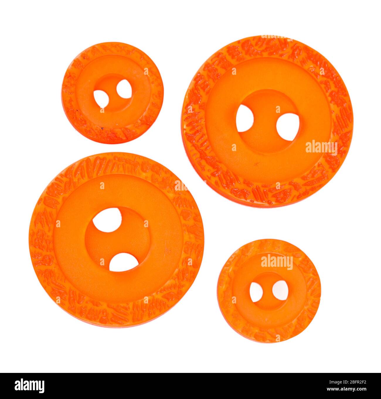bright orange sewing buttons isolated on white Stock Photo - Alamy