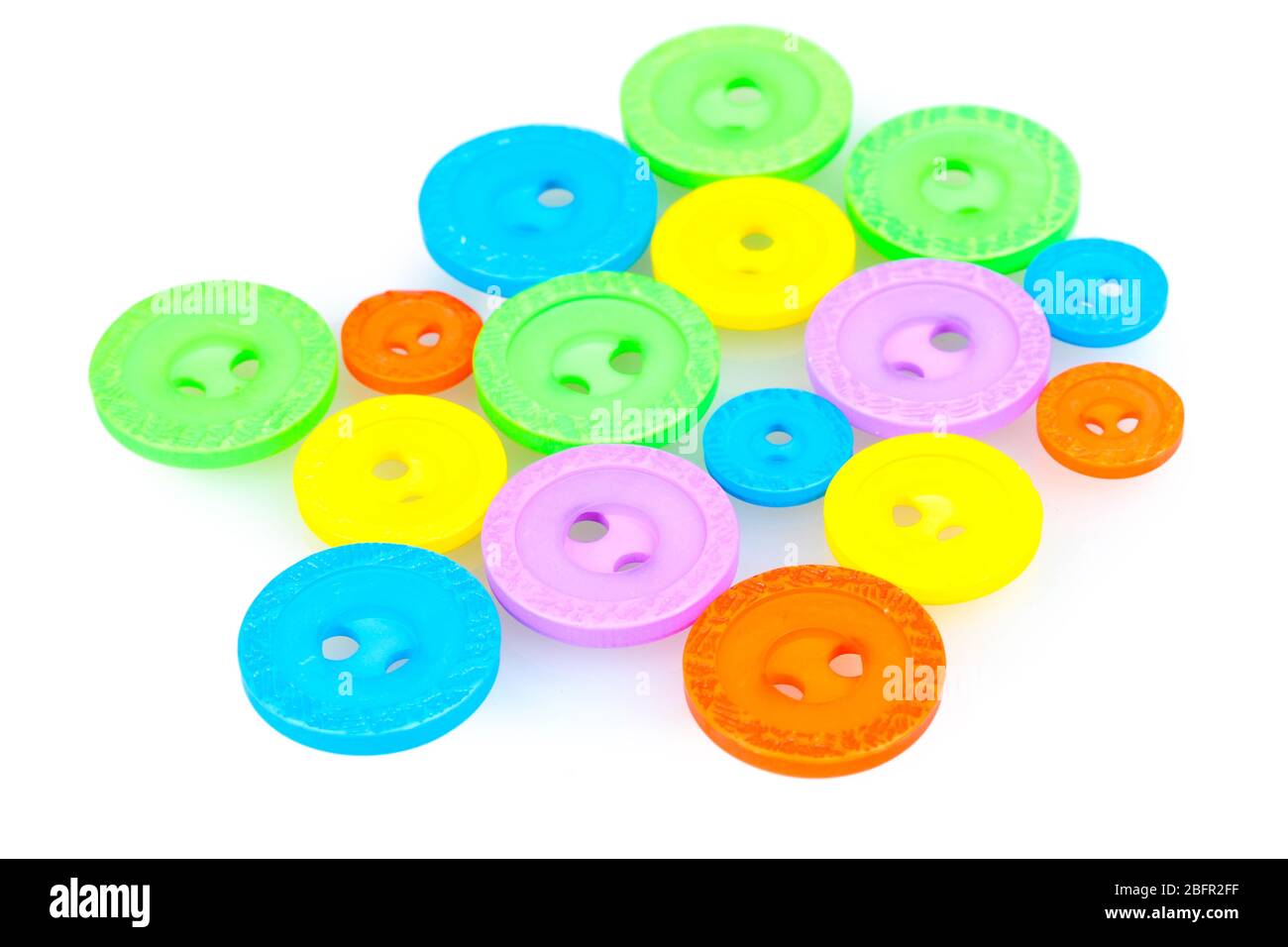 bright sewing buttons isolated on white Stock Photo - Alamy