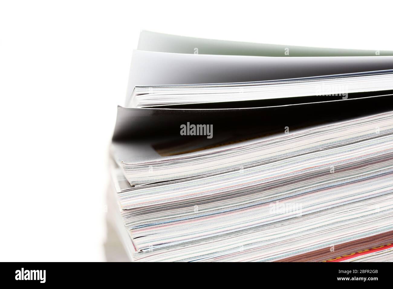 stack of magazines isolated on white Stock Photo - Alamy