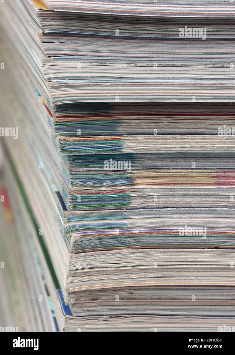stack of magazines isolated on white Stock Photo - Alamy