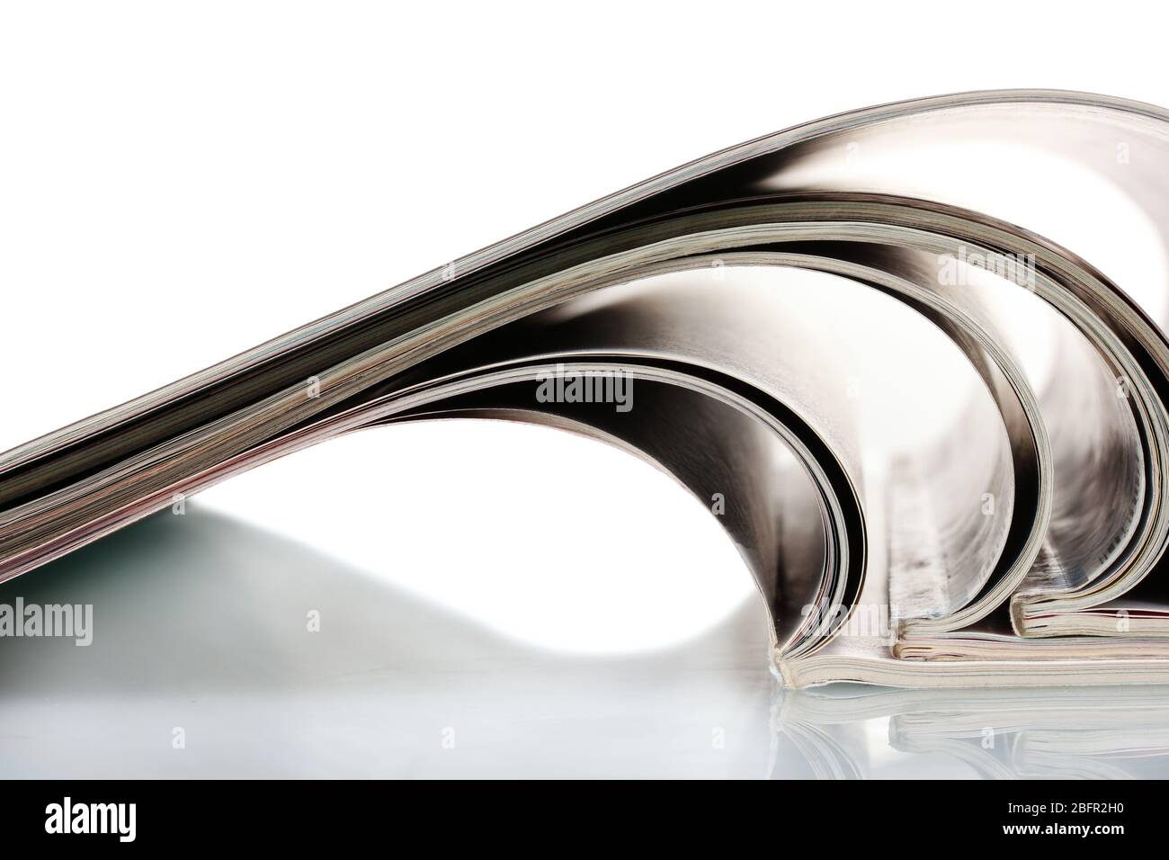 open magazines isolated on white Stock Photo - Alamy