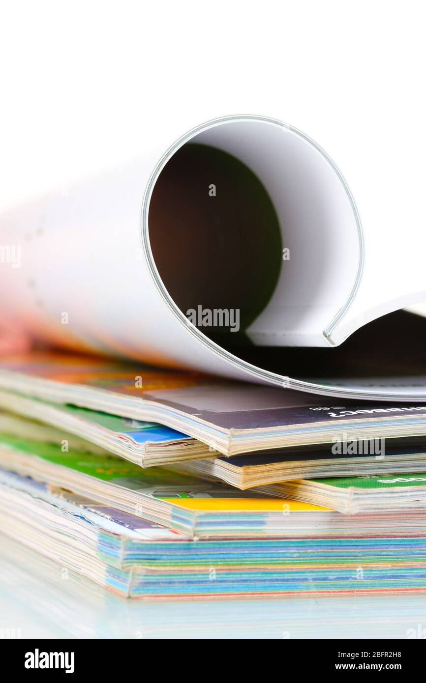 stack of magazines isolated on white Stock Photo - Alamy