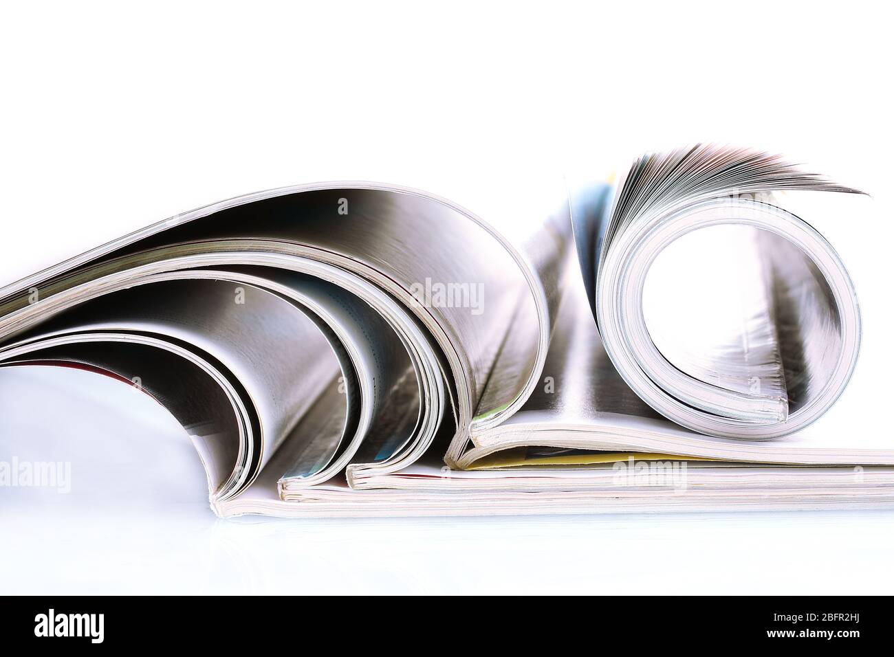 open magazines isolated on white Stock Photo - Alamy