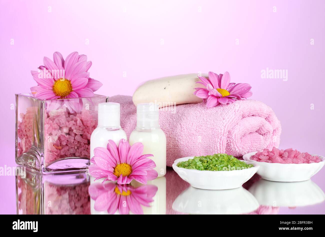 Hotel amenities kit on pink background Stock Photo - Alamy