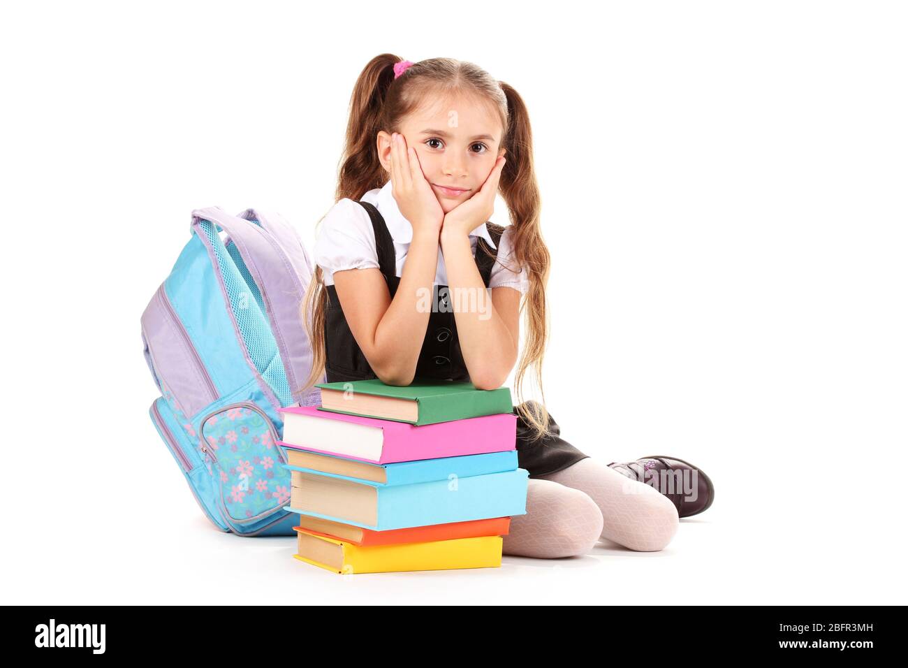 beautiful little girl, books and a backpack isolated on white Stock ...