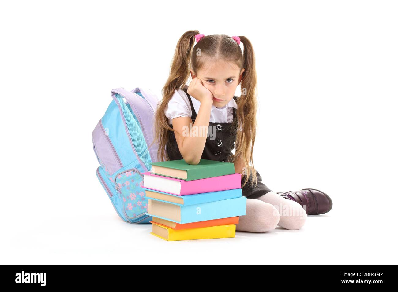 beautiful little girl, books and a backpack isolated on white Stock ...