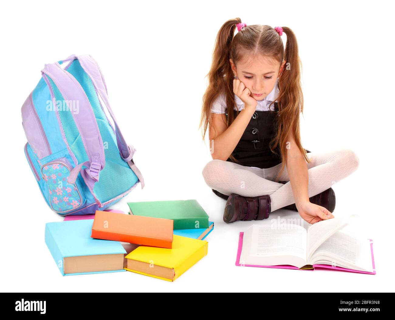 beautiful little girl, books and a backpack isolated on white Stock ...