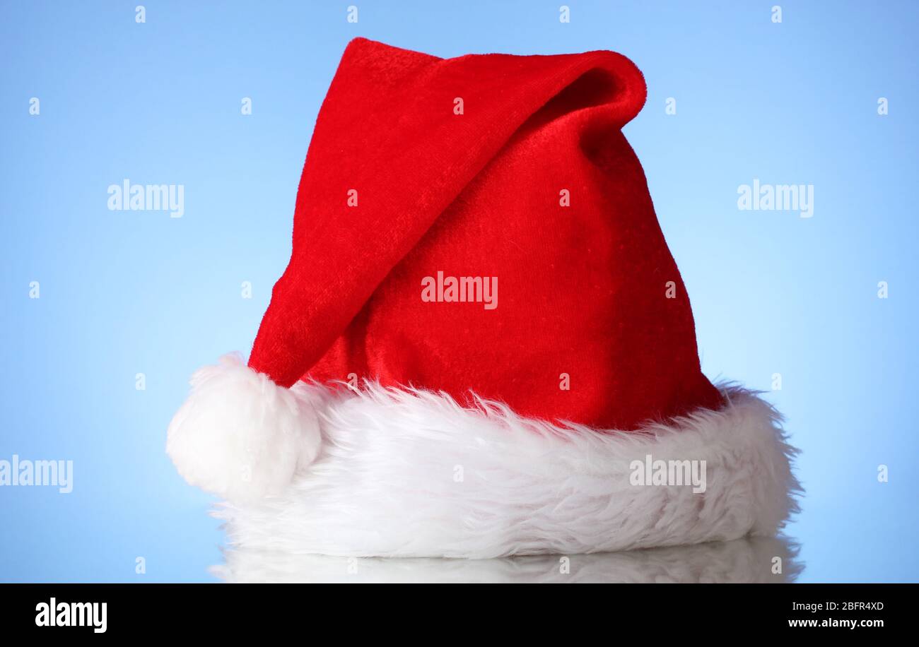 Beautiful Christmas hat on a blue background Stock Photo - Alamy
