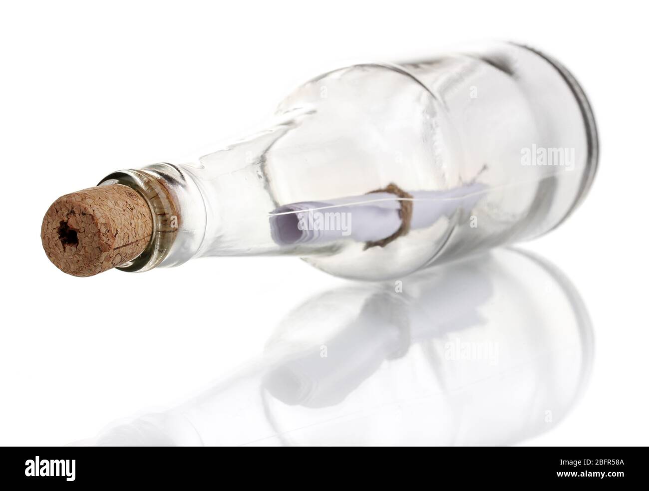 Glass bottle with note inside isolated on white Stock Photo - Alamy