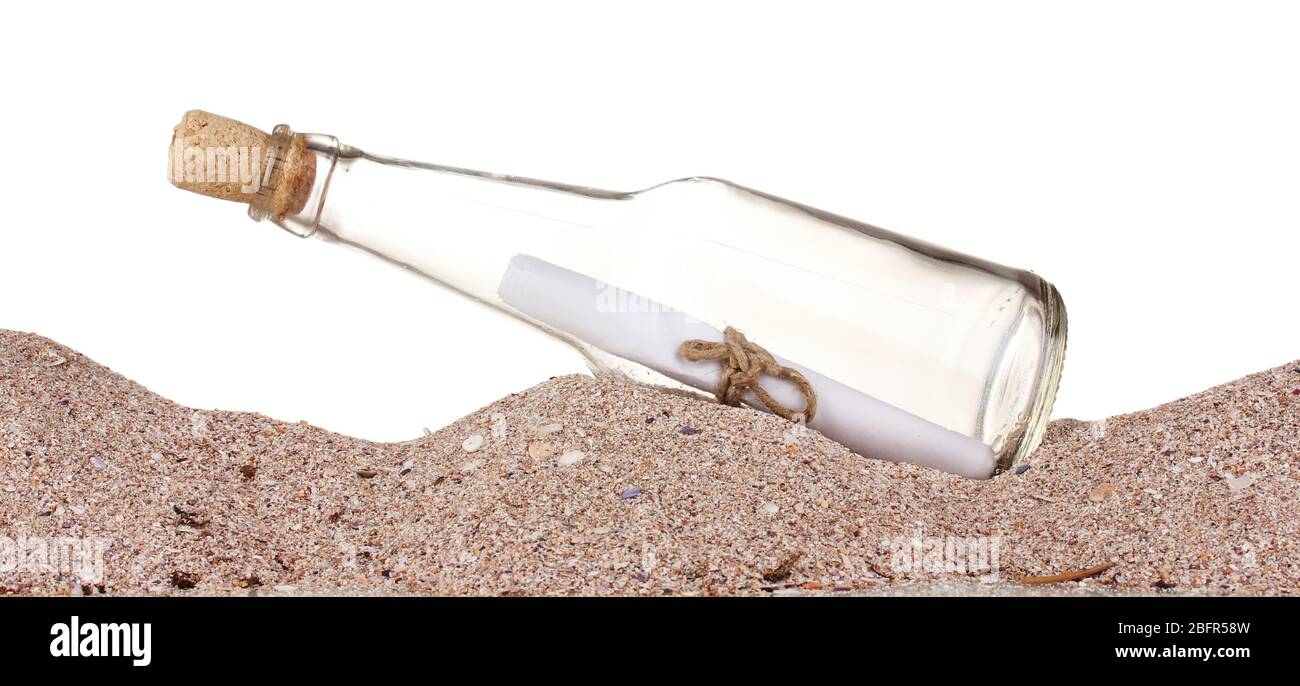 Glass bottle with note inside on sand on white background Stock Photo ...