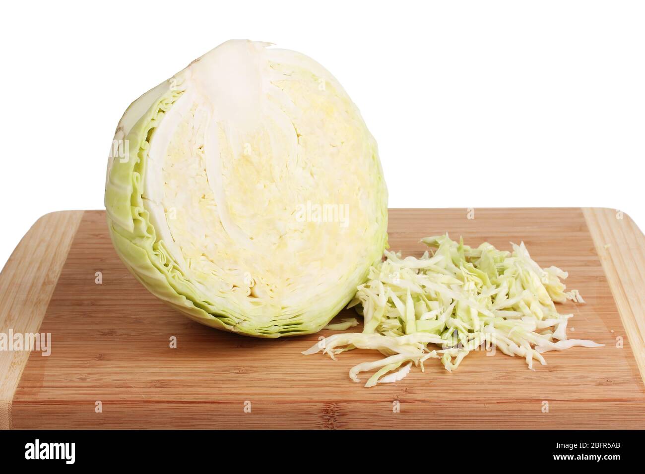 green cabbage shredded on wooden board isolated on white Stock Photo ...