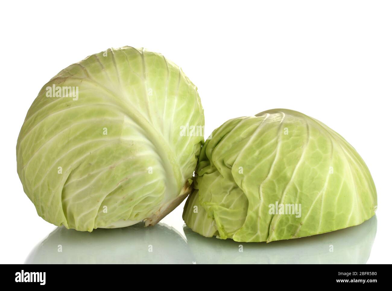 Whole cabbage and half isolated on white Stock Photo - Alamy