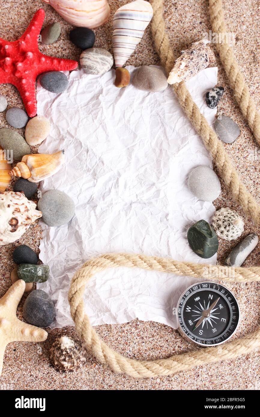 Blank paper on sand beach with seashells and starfishes Stock Photo - Alamy