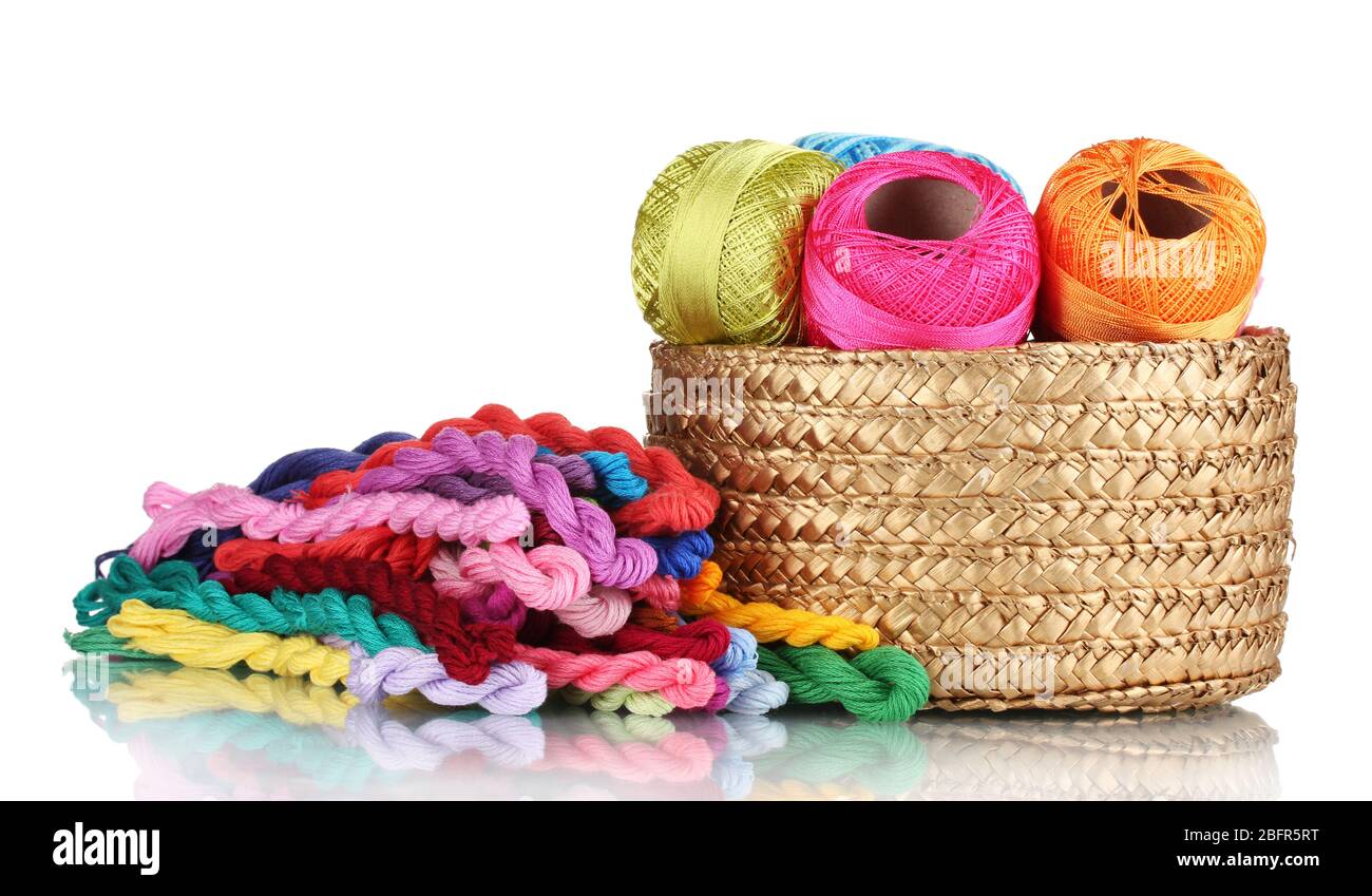 bright threads for needlework and fabric in a wicker basket Stock Photo ...