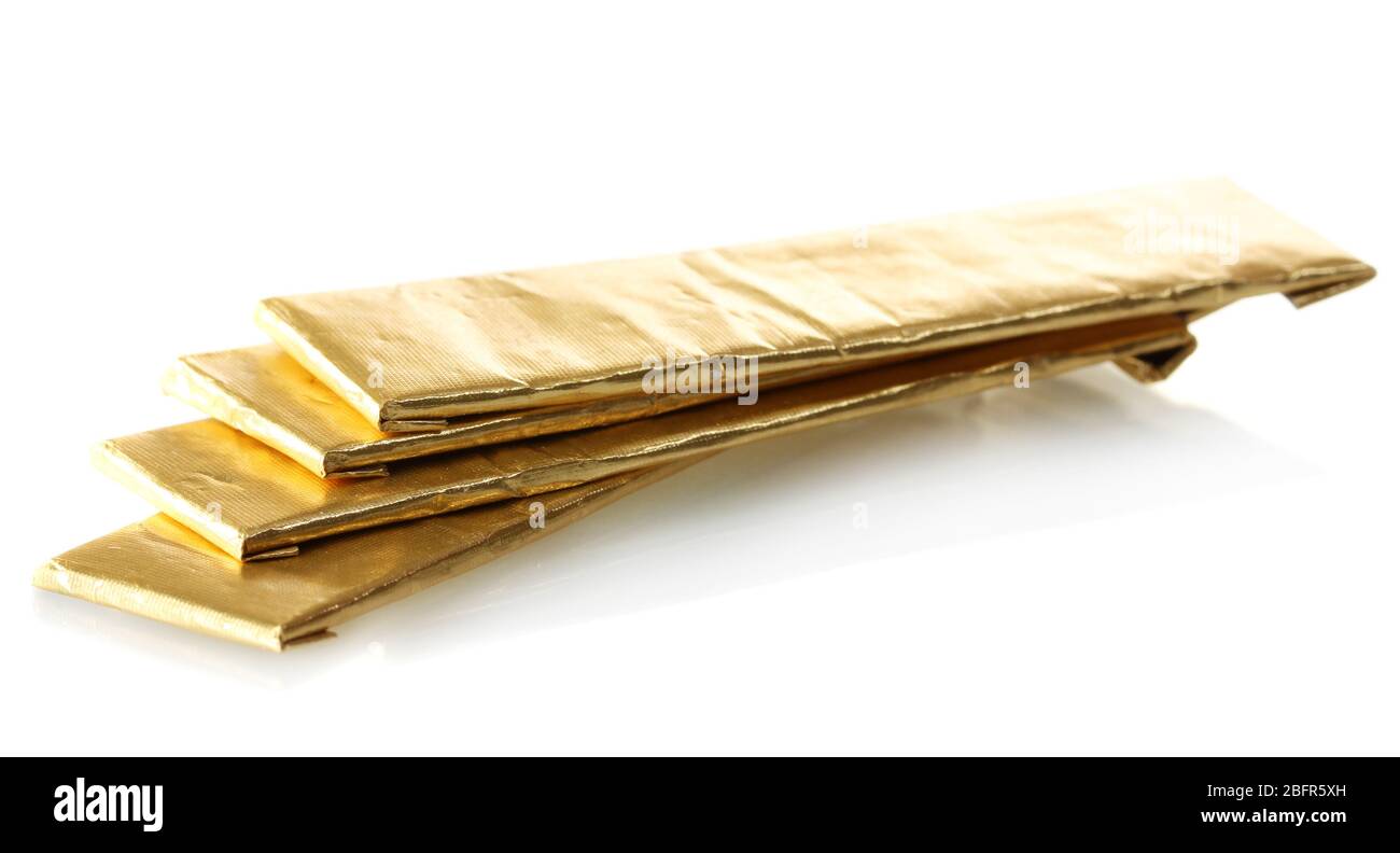 chewing gums wrapped in golden foil, isolated on white Stock Photo - Alamy