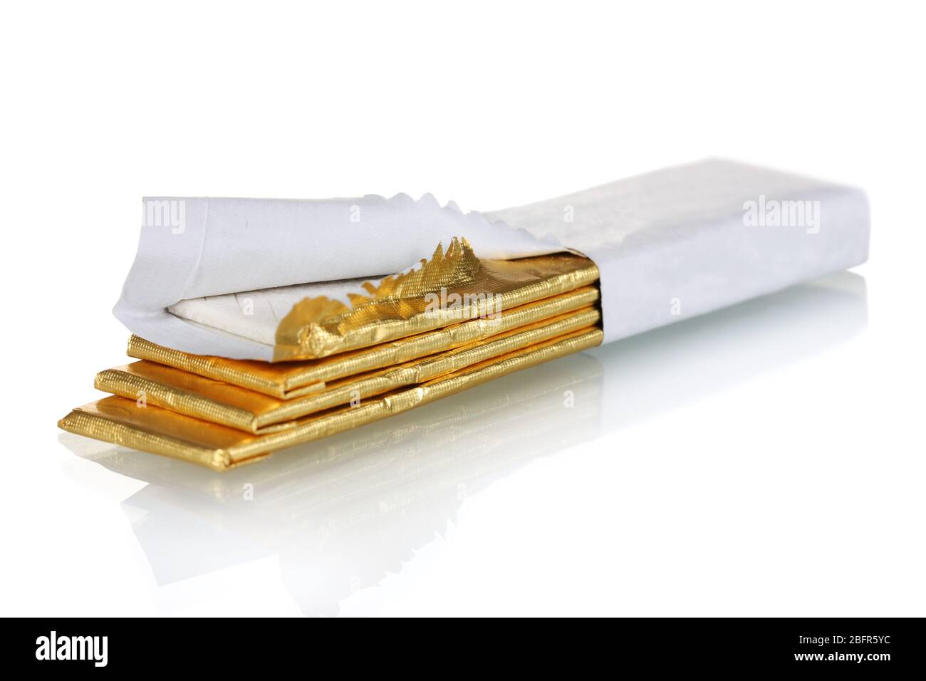 chewing gums wrapped in golden foil, isolated on white Stock Photo - Alamy