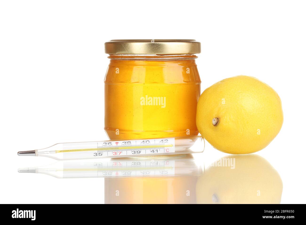 honey, lemon and thermometer isolated on white Stock Photo - Alamy