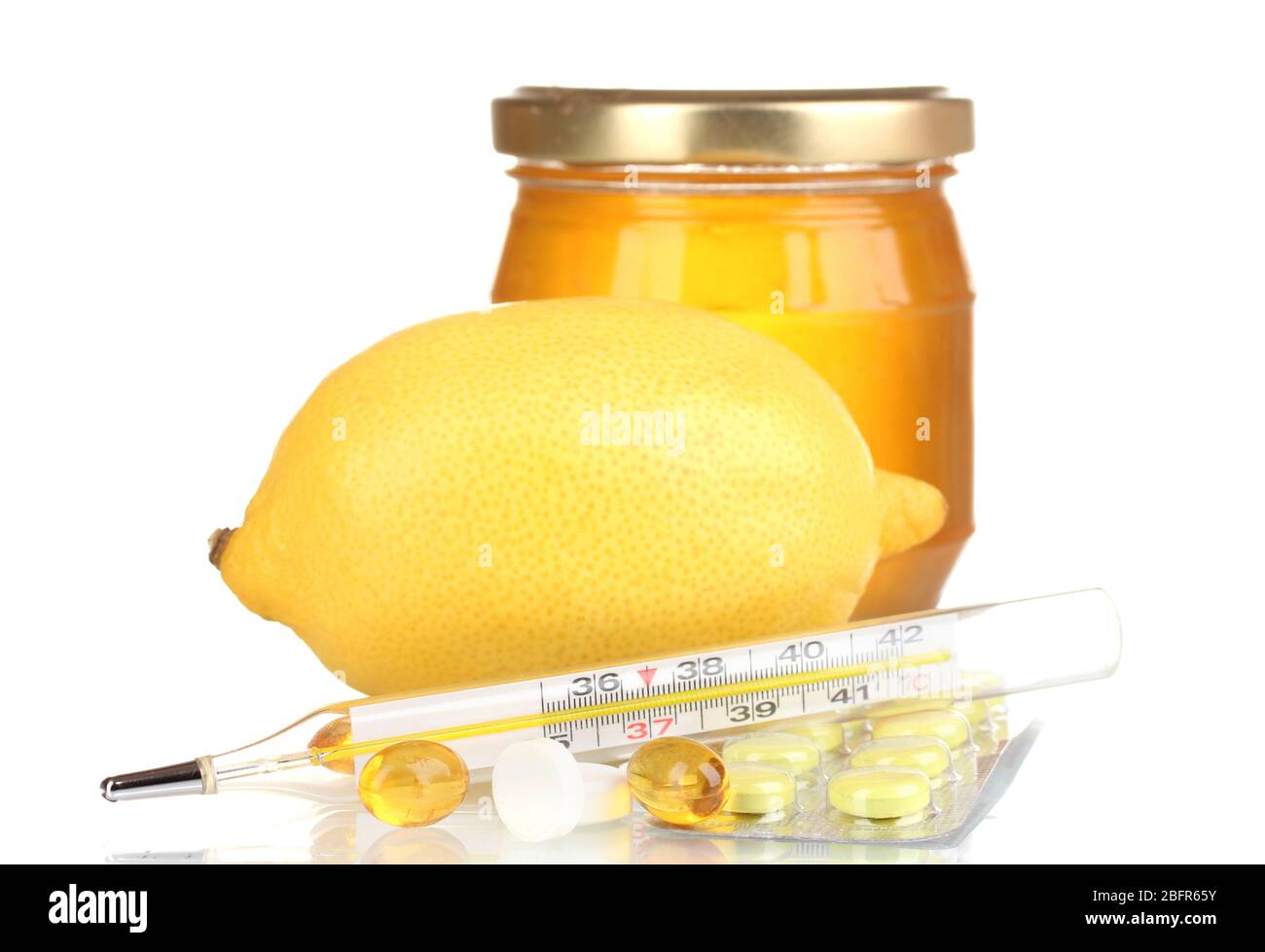 honey, lemon and thermometer isolated on white Stock Photo - Alamy