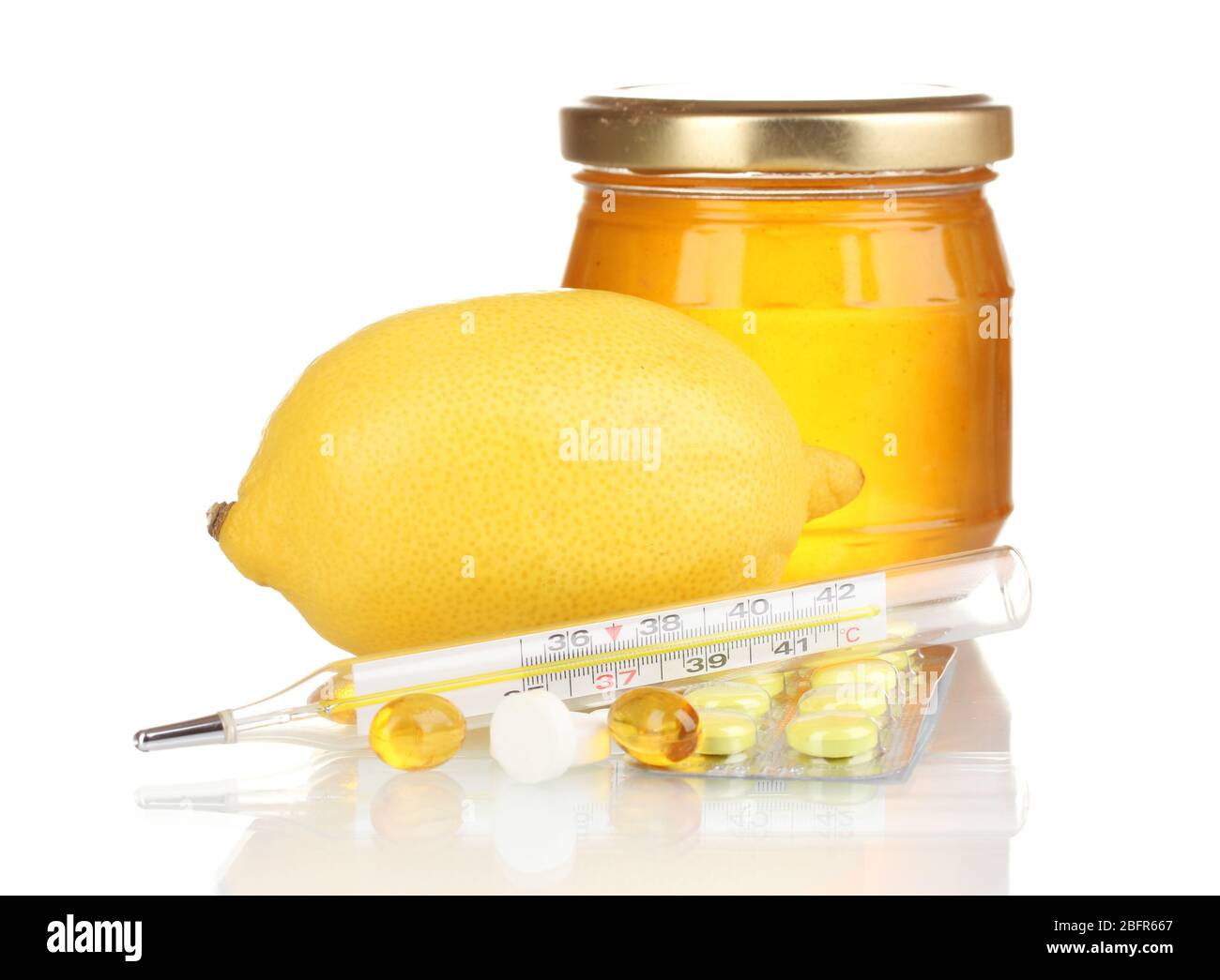 honey, lemon and thermometer isolated on white Stock Photo - Alamy