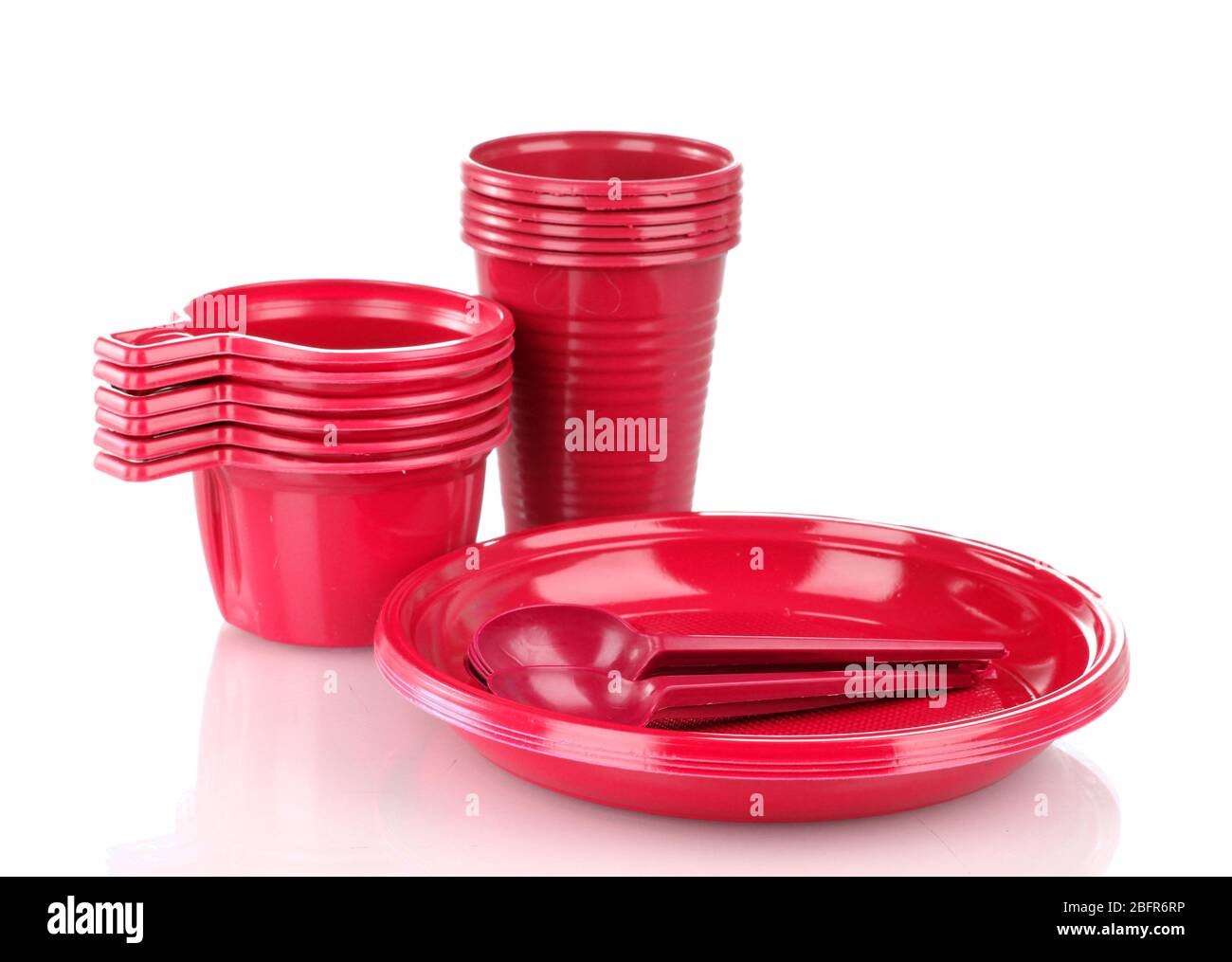 Bright red plastic tableware isolated on white Stock Photo - Alamy