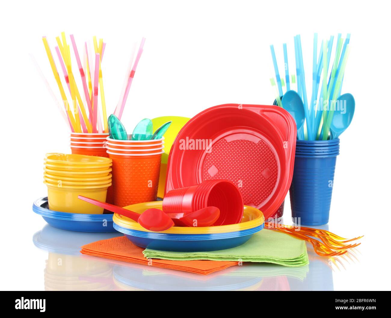 Bright plastic tableware and napkins isolated on white Stock Photo - Alamy