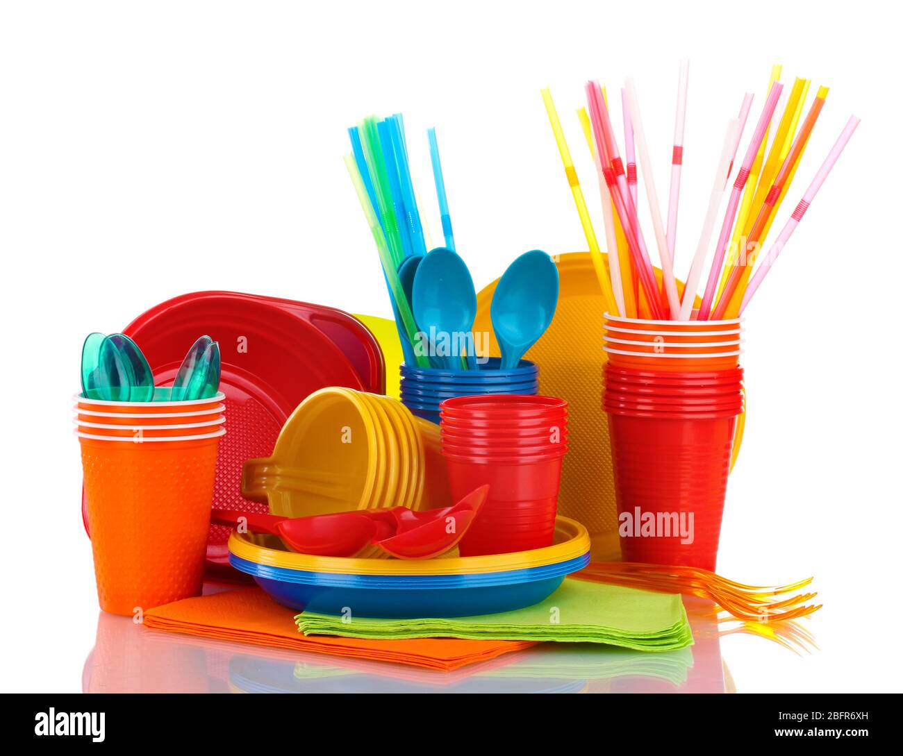 Bright plastic tableware and napkins isolated on white Stock Photo - Alamy