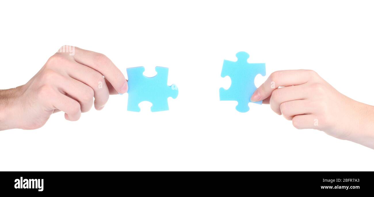 Hands and puzzle, isolated on white Stock Photo - Alamy