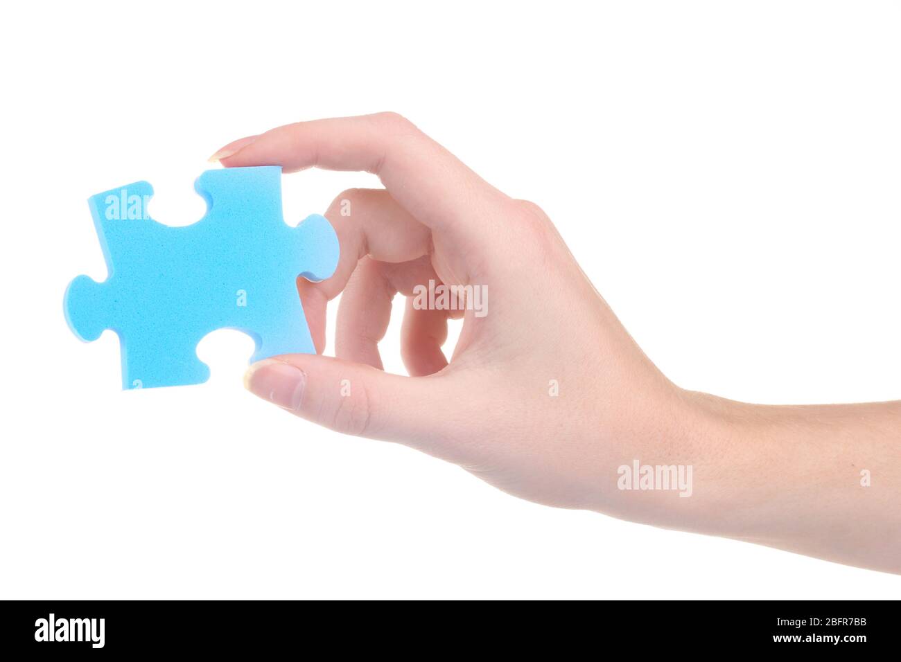 Hand and puzzle, isolated on white Stock Photo - Alamy