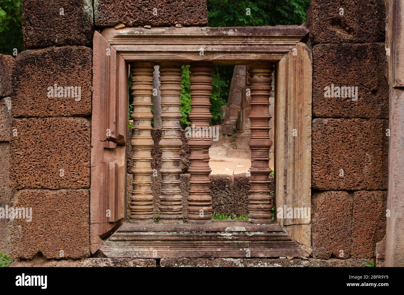 Ruin of column window, typical of the ancient Khmer temples of Angkor ...
