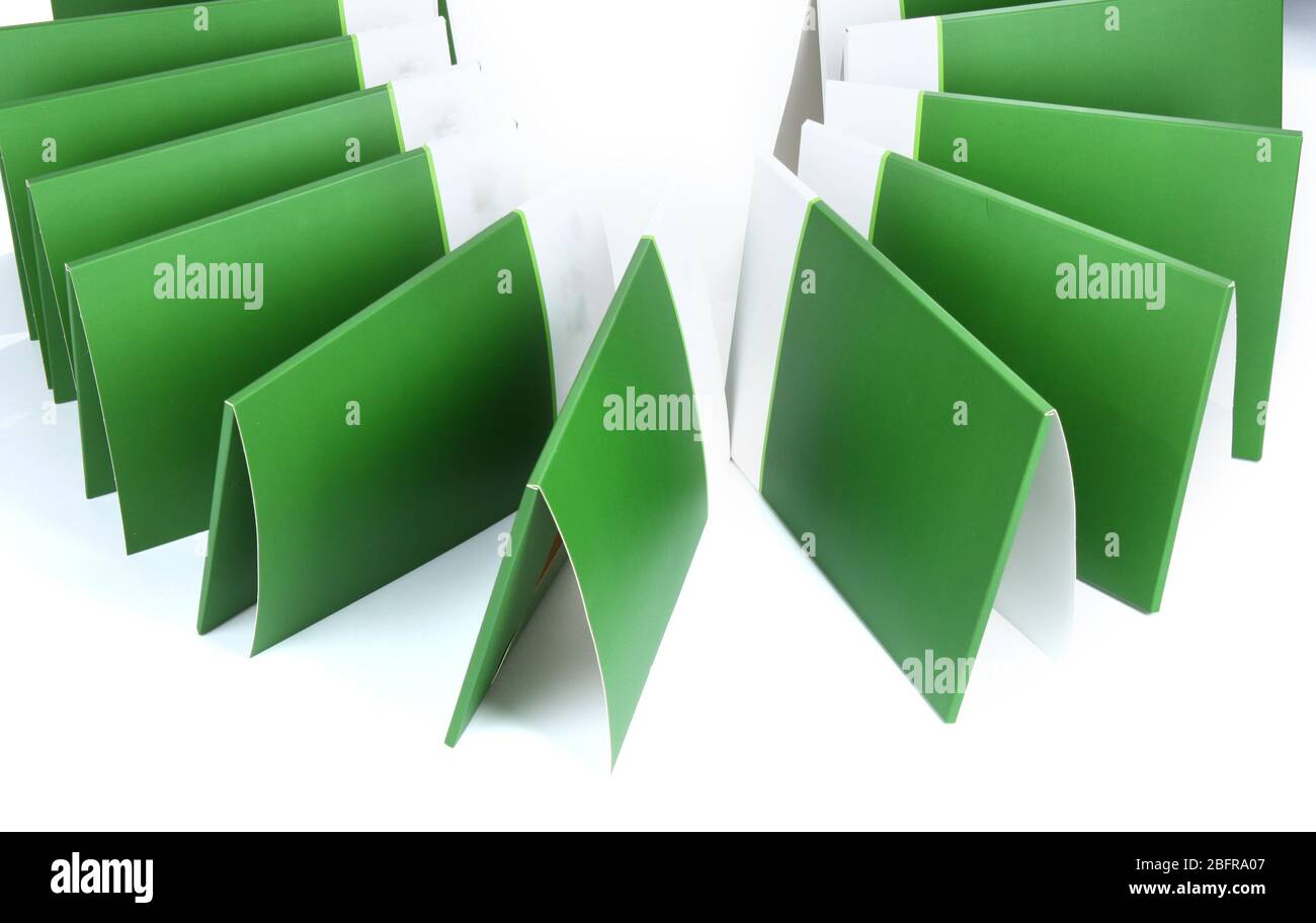 Many green folders isolated on white Stock Photo - Alamy