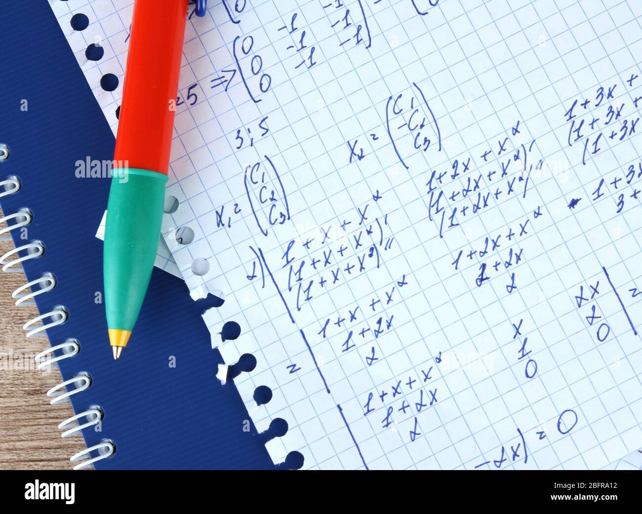 Math on copybook page closeup Stock Photo - Alamy