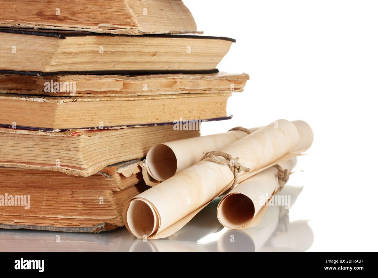 Pile of old books and scroll isolated on white Stock Photo - Alamy