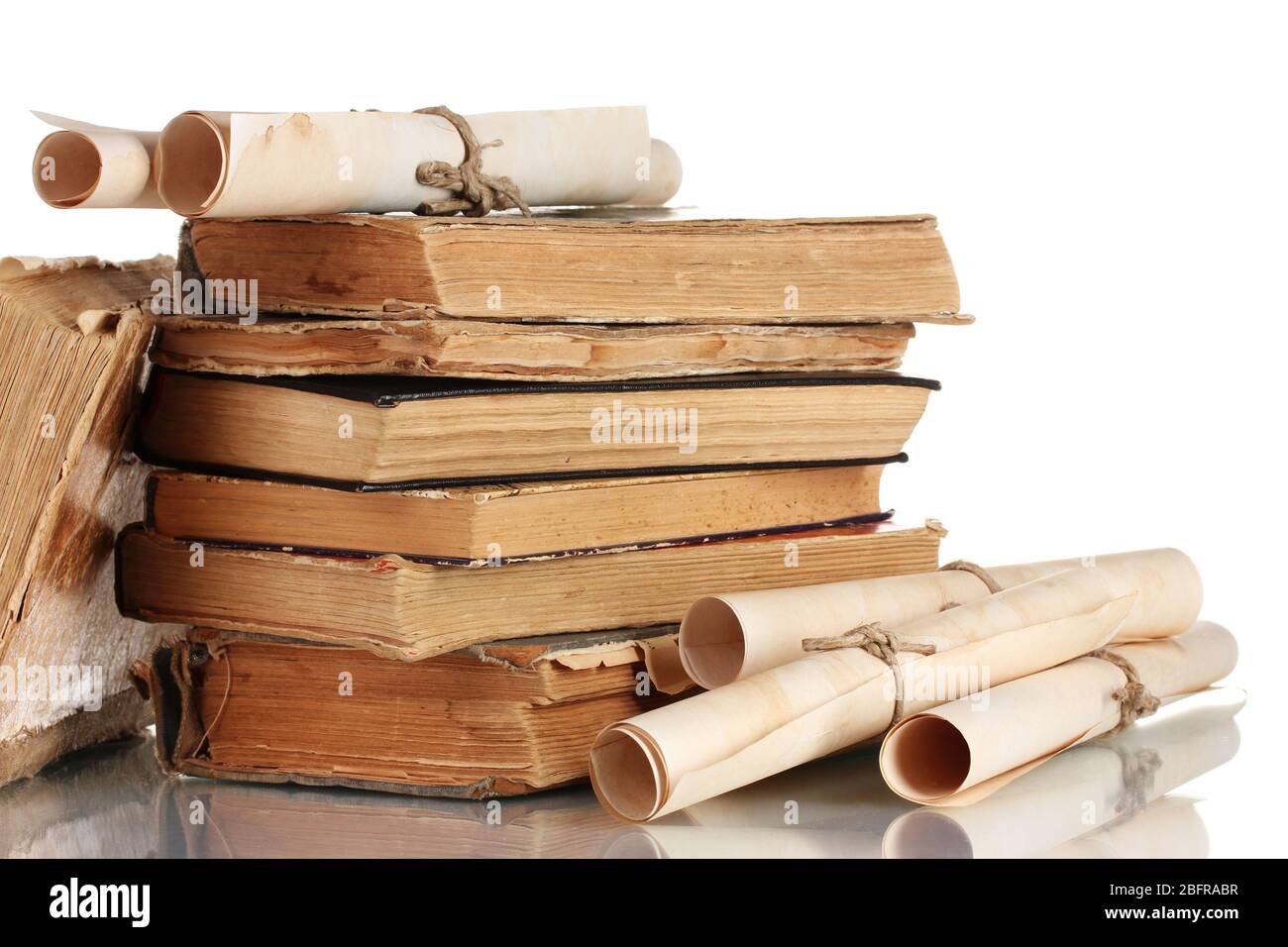 Pile of old books and scroll isolated on white Stock Photo - Alamy