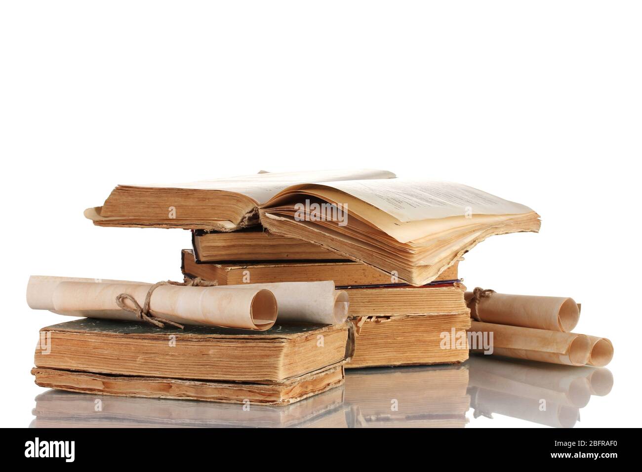 Pile of old books and scroll isolated on white Stock Photo - Alamy