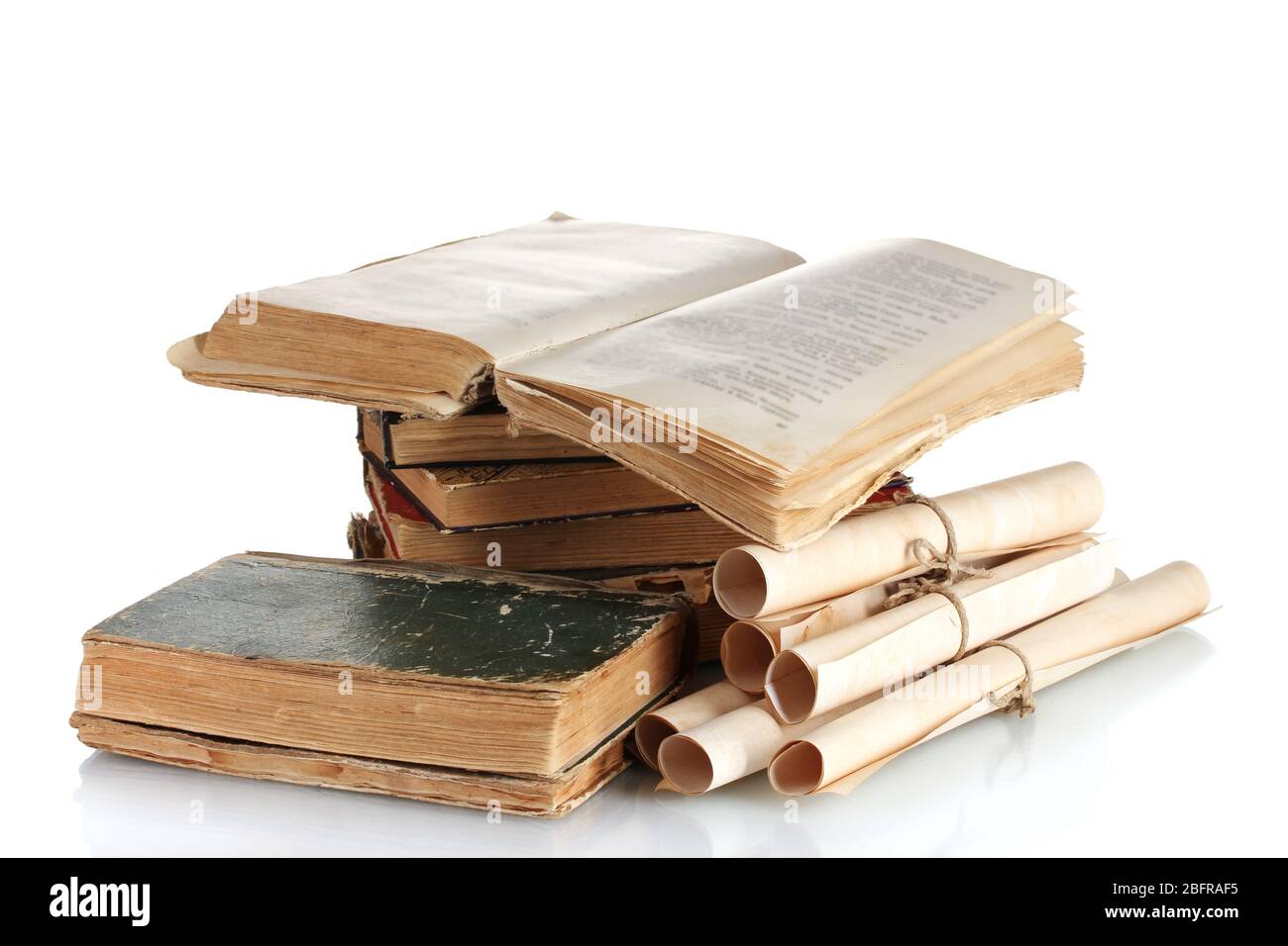 Pile of old books and scroll isolated on white Stock Photo - Alamy