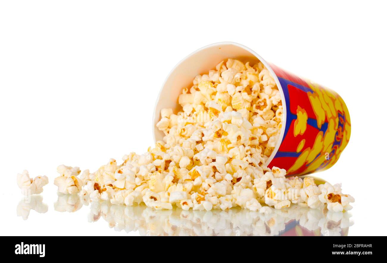 Full bucket of popcorn dropped isolated on white Stock Photo - Alamy