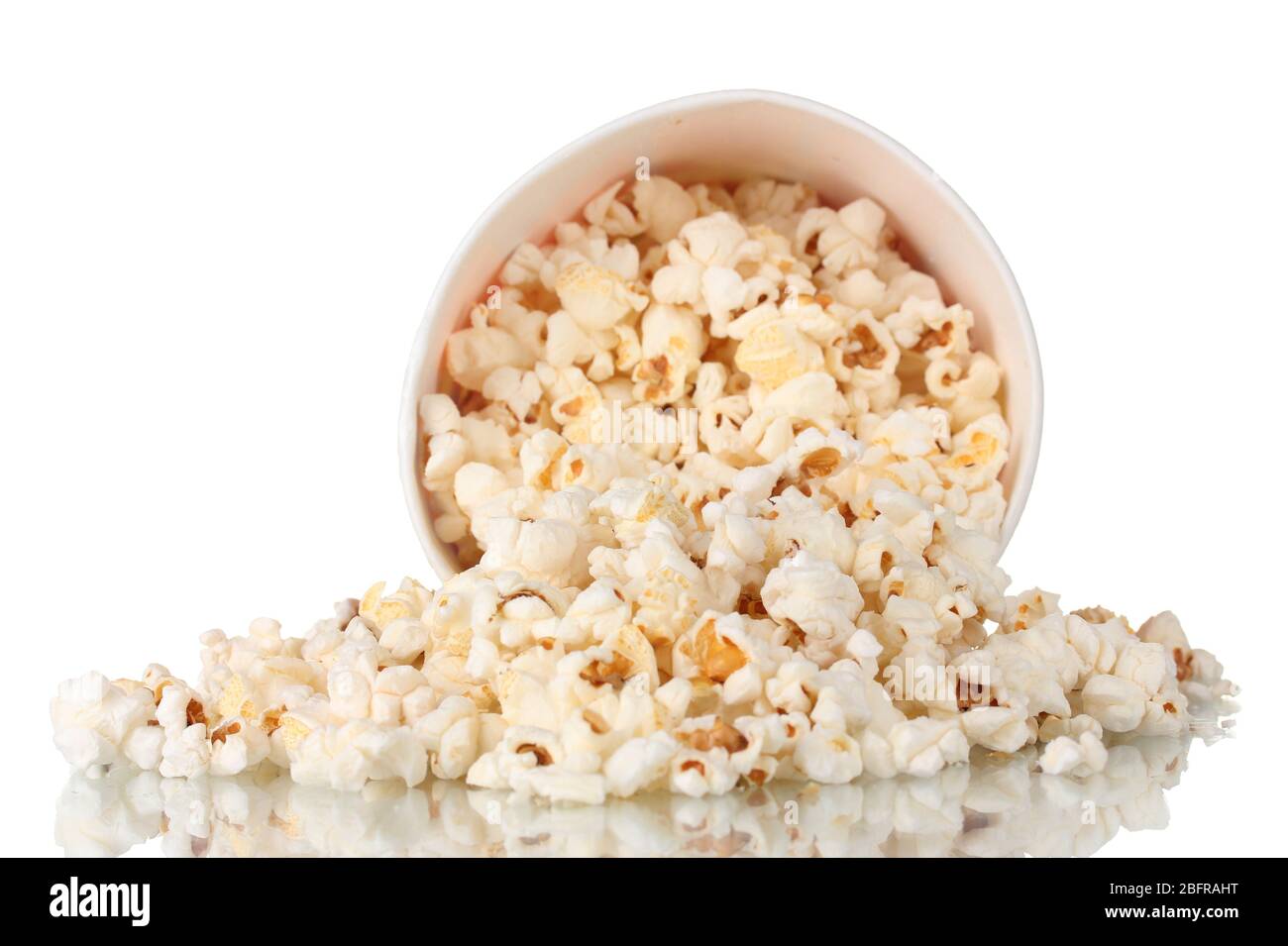 Full bucket of popcorn dropped isolated on white Stock Photo - Alamy