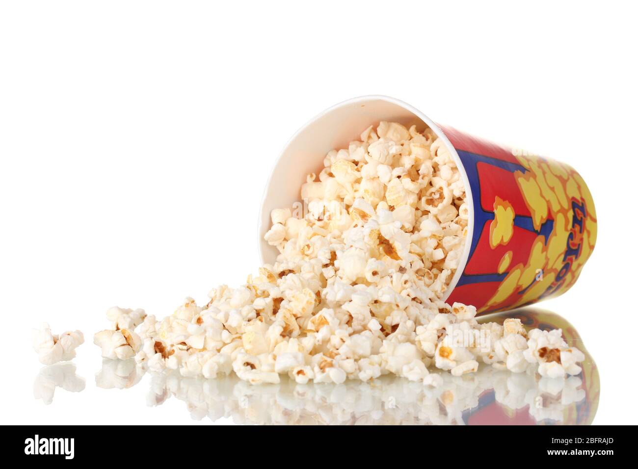 Full bucket of popcorn dropped isolated on white Stock Photo - Alamy