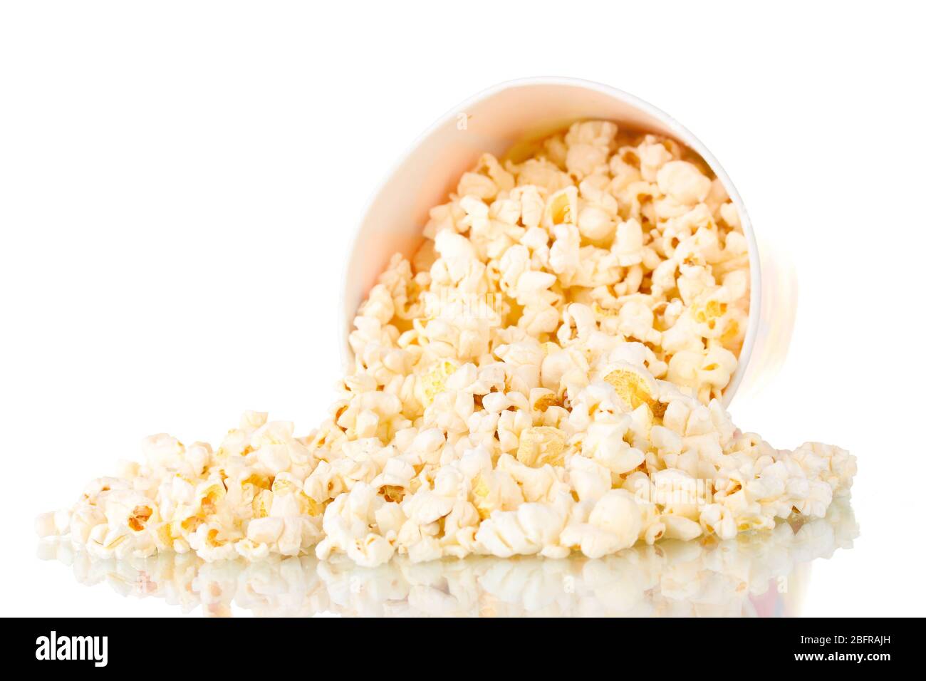 Full bucket of popcorn dropped isolated on white Stock Photo - Alamy