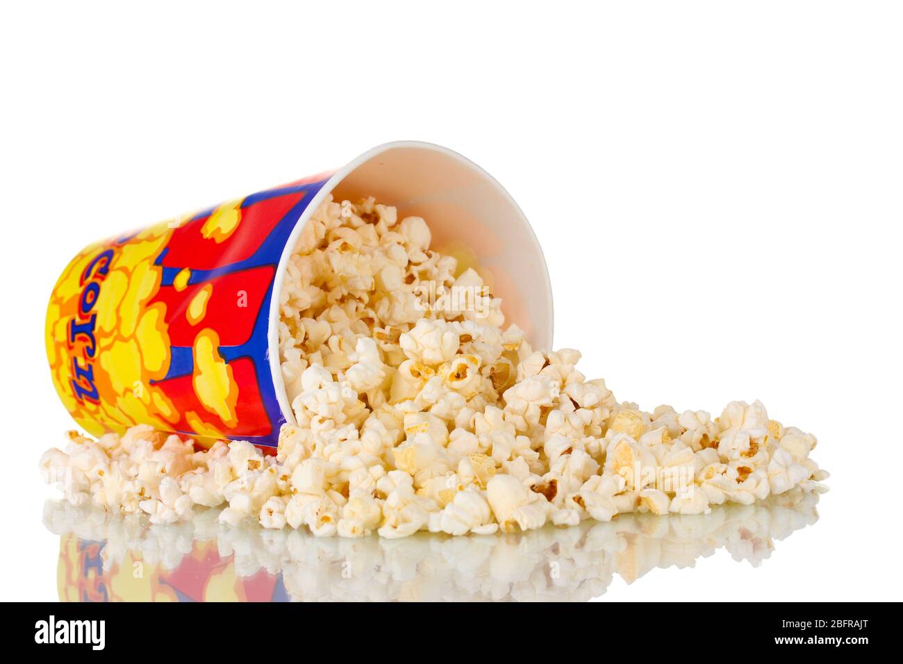 Full bucket of popcorn dropped isolated on white Stock Photo - Alamy