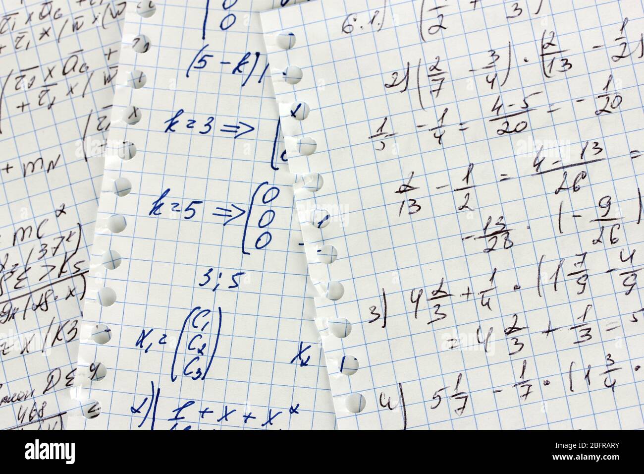 Math, physics and geometry on copybook page closeup Stock Photo - Alamy