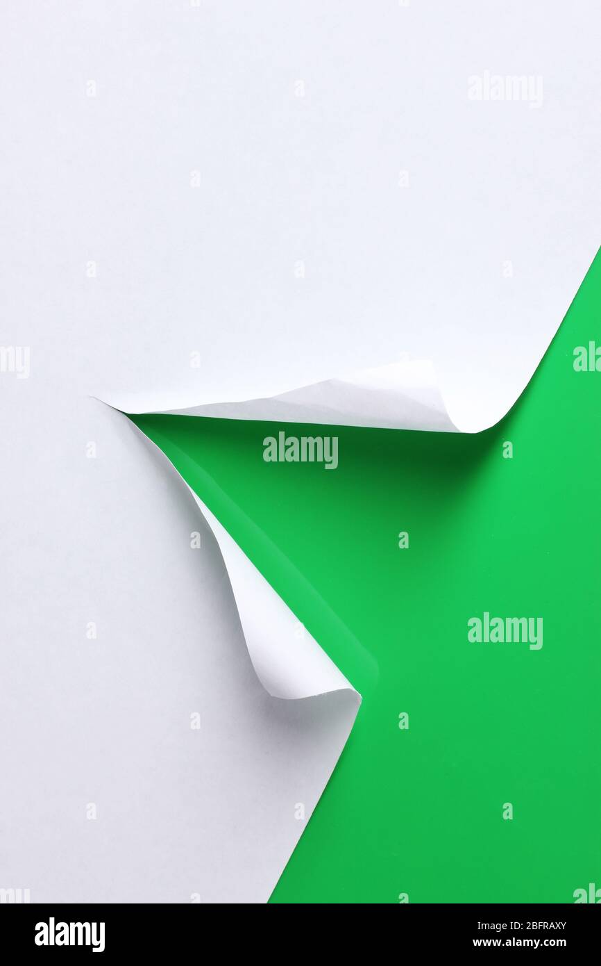 Torn paper with green background Stock Photo - Alamy
