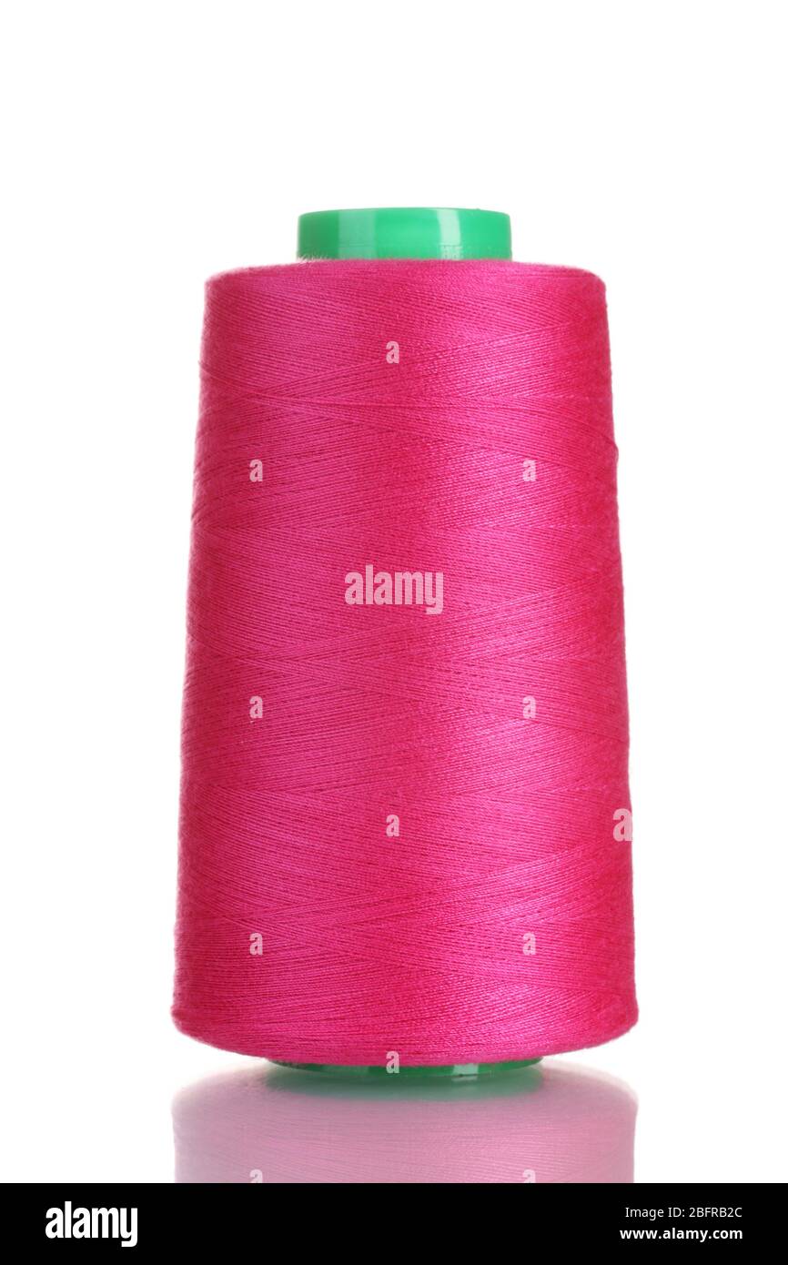 Pink bobbin thread isolated on white Stock Photo - Alamy