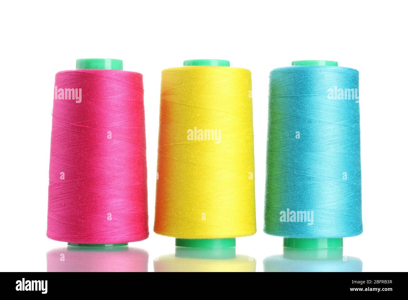 Bobbins of thread isolated on white Stock Photo - Alamy