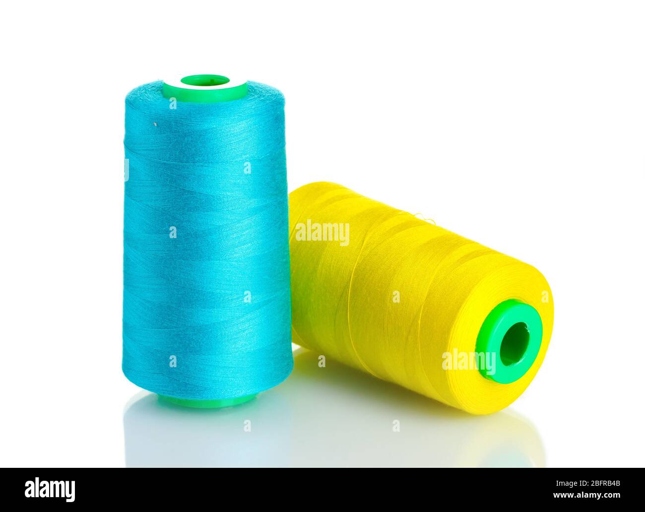 Bobbins of thread isolated on white Stock Photo - Alamy