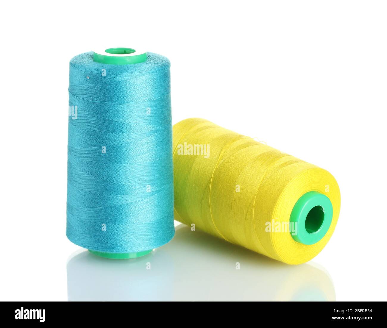 Bobbins of thread isolated on white Stock Photo - Alamy