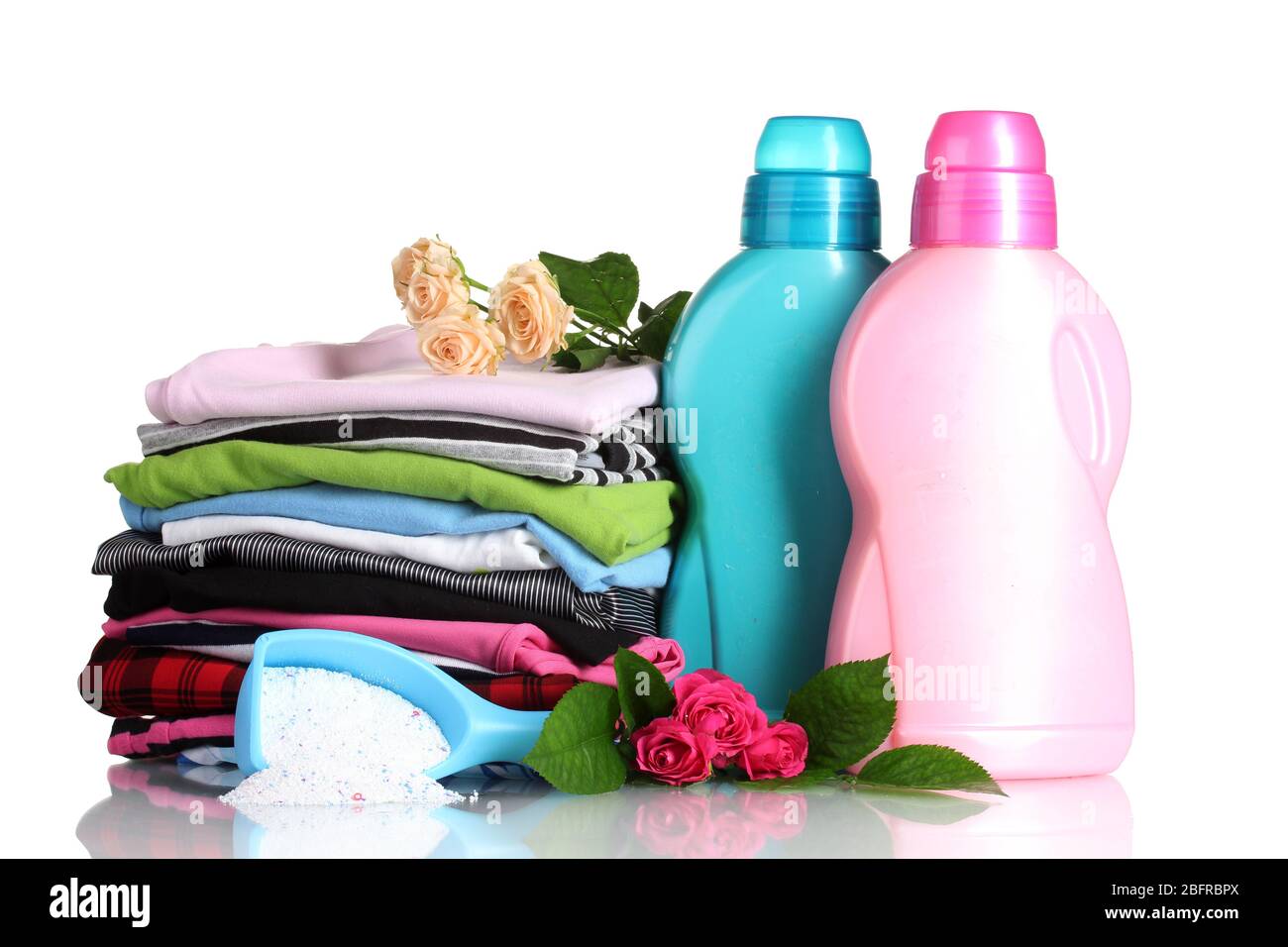 Detergent with washing powder and pile of colorful clothes isolated on ...
